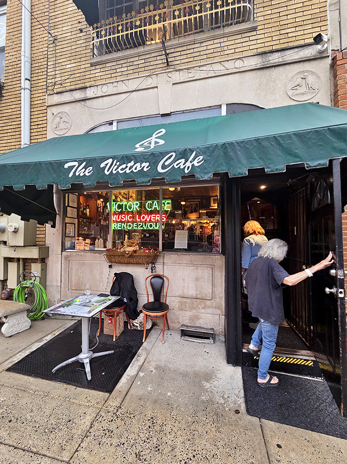 The iconic green awning of Victor Caf&eacute; beckons like an old friend, promising both culinary delights and musical surprises behind those doors.