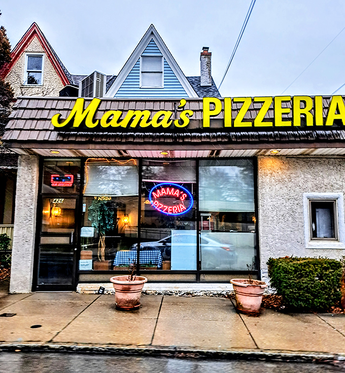 The iconic yellow Mama's Pizzeria sign beckons hungry travelers like a cheesesteak lighthouse on Belmont Avenue. No fancy frills, just the promise of sandwich perfection.