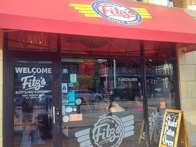 The iconic red awning of Fitz's beckons hungry travelers like a lighthouse for the famished. Welcome to burger paradise on Delmar Boulevard!