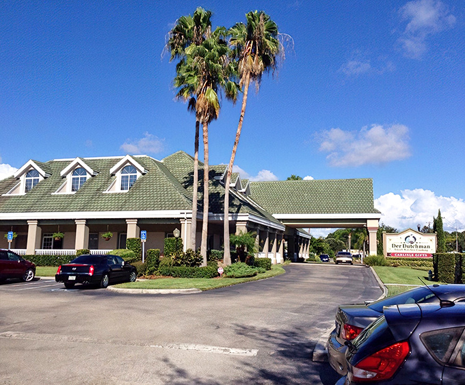Palm trees meet Amish country at Der Dutchman, where Florida sunshine greets heartland hospitality under that distinctive green roof.