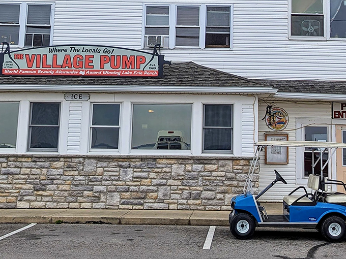 The unassuming white clapboard exterior of The Village Pump stands like a culinary lighthouse on Kelleys Island, beckoning hungry travelers with promises of Lake Erie's finest.