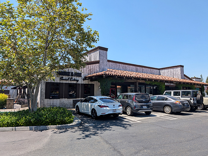 The rustic wooden exterior of Smoke And Fire beckons like a barbecue mirage in the California sun, promising smoky delights within.