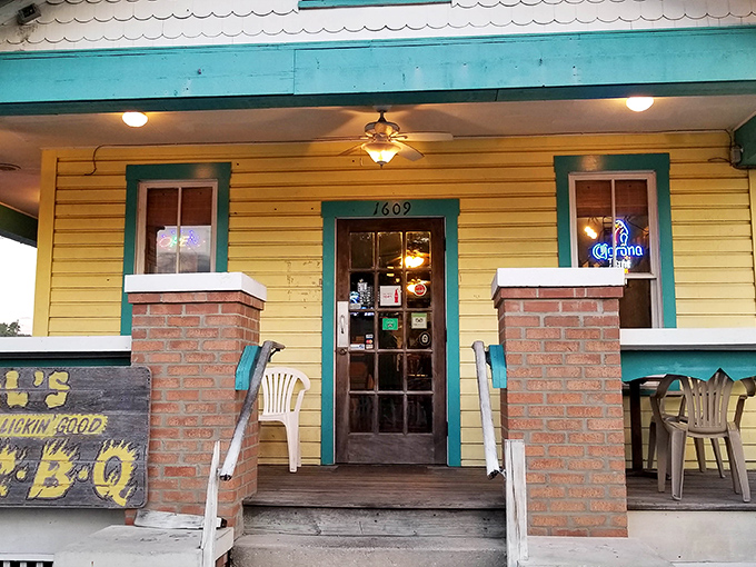 The cheerful yellow exterior with turquoise trim isn't just eye-catching&mdash;it's a beacon calling hungry souls to barbecue salvation in Ybor City.