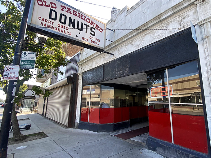 The unassuming storefront of Old Fashioned Donuts stands like a time capsule on Chicago's South Side, promising sweet treasures within those red-trimmed windows. 