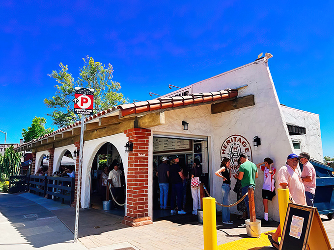 The Spanish-style exterior of Heritage Barbecue belies the Texas-sized flavors within. That line of eager patrons? They know what's coming.