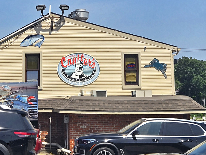 Cantler's iconic sign welcomes seafood pilgrims with the promise of maritime delights. The blue crab silhouette isn't just decoration&mdash;it's a preview of coming attractions.