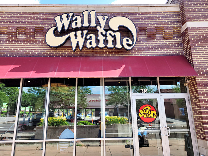 The iconic Wally Waffle storefront in Akron beckons with its retro sign and welcoming red awning&mdash;like a breakfast beacon calling you home.