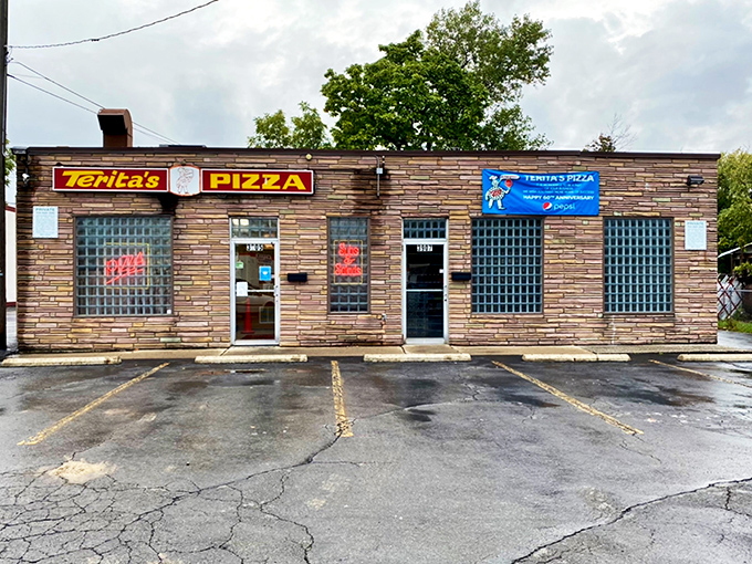 The unassuming stone facade of Terita's Pizza stands like a time capsule on Cleveland Avenue, promising pizza perfection behind those glass-block windows.