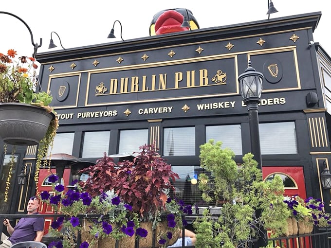 The Dublin Pub's striking black and gold fa&ccedil;ade stands as a beacon of Irish hospitality in Dayton's Oregon District, promising authentic flavors and good times within.