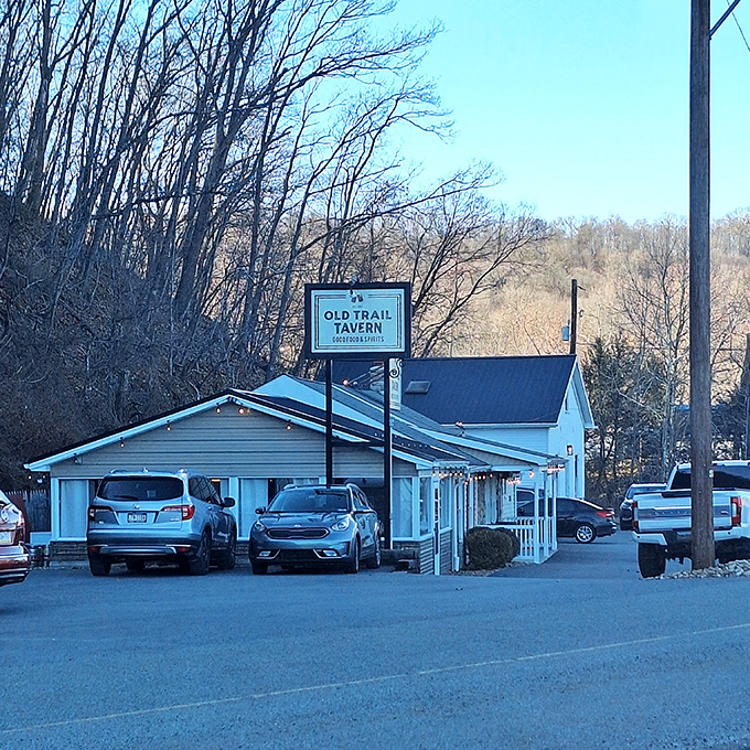 The unassuming exterior of Old Trail Tavern + Steak stands like a culinary speakeasy, hiding world-class steaks behind its modest façade.