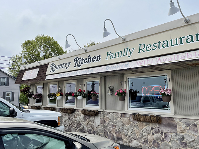 The unassuming exterior of Kountry Kitchen belies the culinary treasures within. Those hanging flower baskets aren't just for show&mdash;they're your first clue that someone inside cares about details.