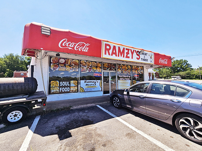 The bright red Coca-Cola awning isn't just eye-catching; it's a beacon of hope for hungry souls seeking authentic Southern comfort on a plate.