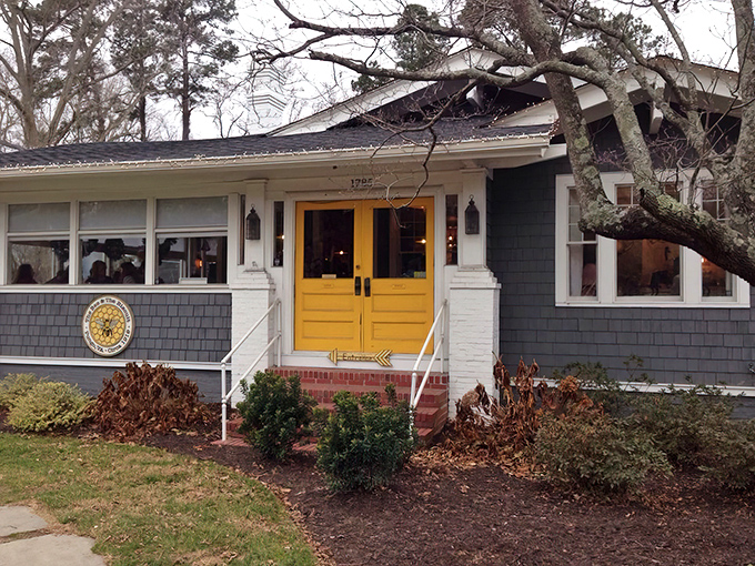Winter can't dim the charm of this cozy blue bungalow. The yellow doors practically whisper, "Yes, we have cinnamon rolls today," to passing motorists.