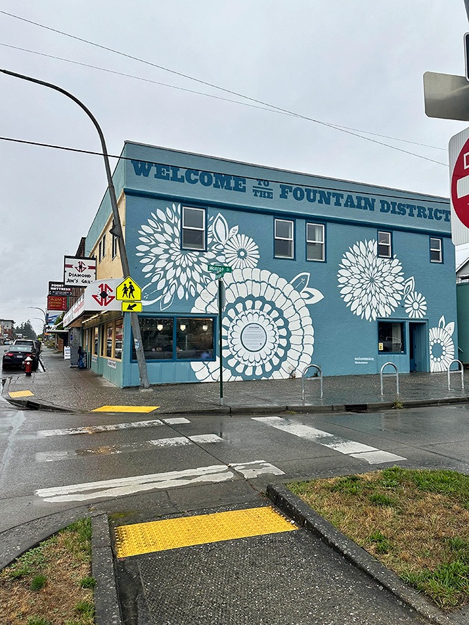 The vibrant blue exterior with white floral designs welcomes you to the Fountain District, promising culinary treasures inside.