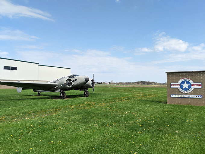 A gleaming silver warbird stands sentinel at the entrance, like a time machine ready to whisk you back to 1944. History with wings and attitude.