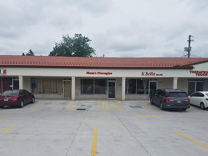 The unassuming storefront of Mom's Pierogies in Brooklyn, Ohio &ndash; where culinary magic happens behind a modest strip mall facade.
