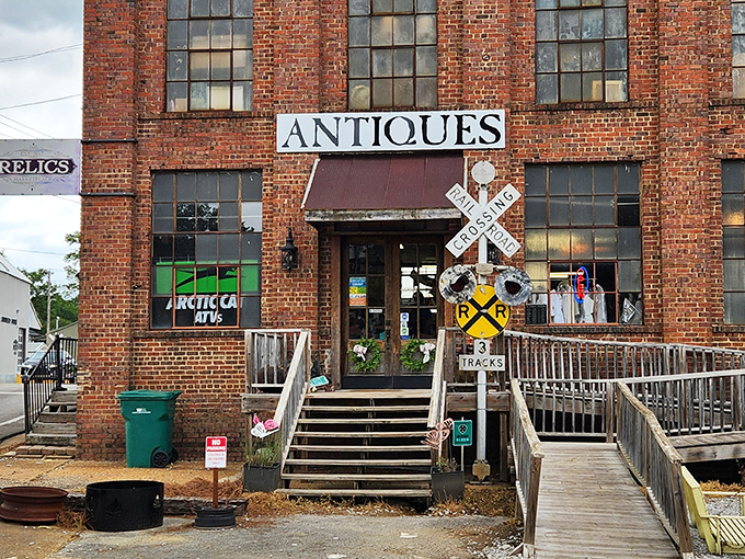 The brick fortress of Relics Antique Marketplace stands proudly in Tupelo, complete with railroad crossing sign&mdash;a perfect sentinel for this time-traveling emporium.