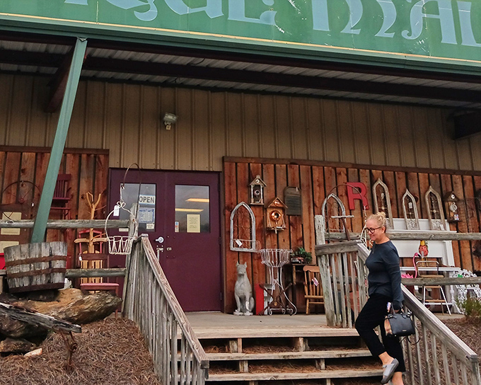 The rustic wooden entrance beckons like a portal to the past, complete with garden ornaments and architectural treasures hinting at wonders within.