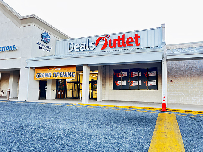 The bright red Deals Outlet sign beckons like a retail lighthouse, promising treasure hunts where your wallet won't walk the plank.