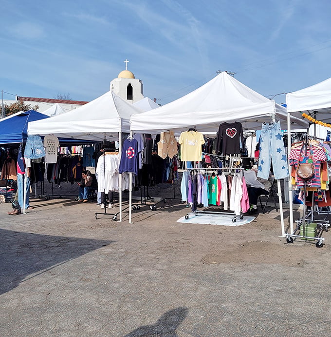 White tents against a blue California sky, with the iconic church dome creating the perfect backdrop for treasure hunting at Silverlake Flea.