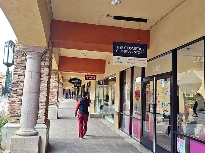 Elegant stone columns and Mediterranean architecture transform this shopping corridor into a high-end retail experience where prices that won't require a second mortgage.
