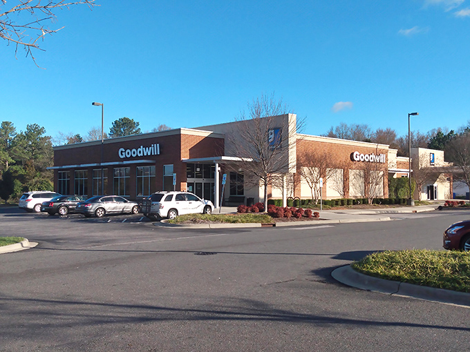 The brick facade of Rock Hill's Goodwill stands like a temple to thrift, its blue logo a beacon to bargain hunters everywhere.