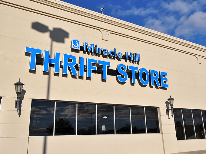 The blue sign beckons like a siren call to bargain hunters. Miracle Hill Thrift Store's bold lettering promises treasures waiting to be discovered inside.