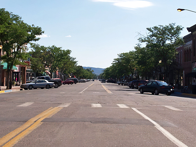 Main Street stretches toward the mountains like a postcard your grandparents would've sent, only better in person.