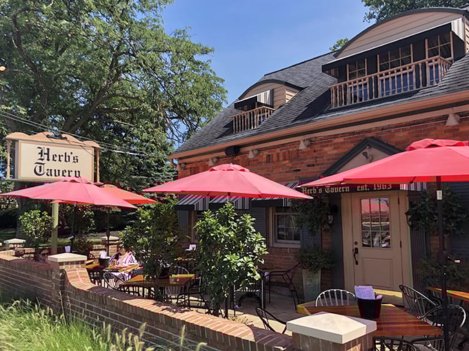 Herb&rsquo;s Tavern stands proudly along Detroit Road, its classic brick exterior and bright red umbrellas inviting locals and travelers alike to stop in for a taste of tradition.