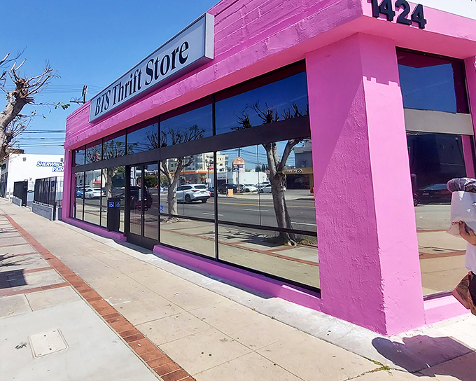 The unmistakable hot pink exterior of BTS Thrift Store stands out like a flamingo in Los Angeles, beckoning treasure hunters with its vibrant promise of discoveries within.
