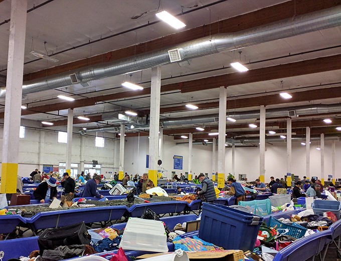 Welcome to treasure hunter paradise! The famous blue bins at Goodwill's Milwaukie outlet store stretch as far as the eye can see, each one a potential gold mine of secondhand surprises.