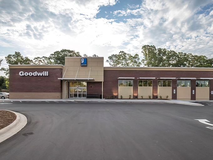 The Fort Mill Goodwill welcomes bargain hunters with its clean brick facade and promise of treasures within. No fancy frills needed when adventure awaits inside.
