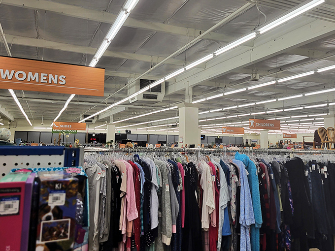 The bright blue Goodwill sign beckons like a thrifty lighthouse, guiding bargain hunters safely to shore in Lynnwood's sea of retail options.