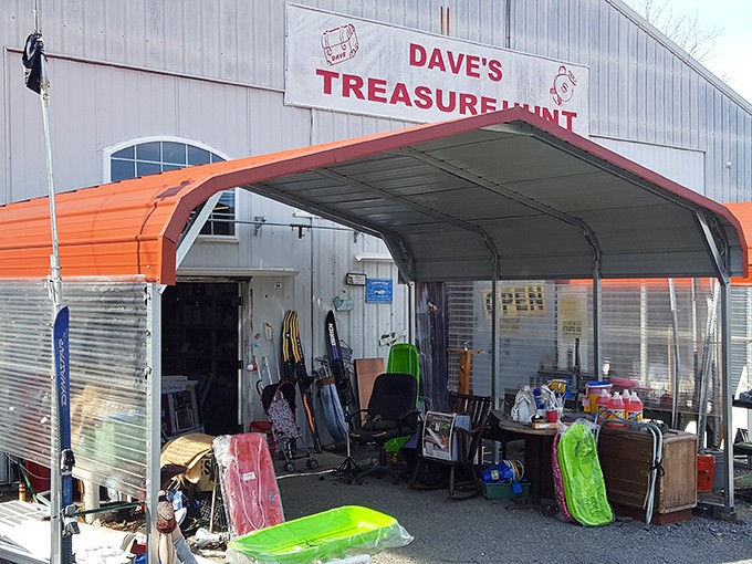 The unassuming entrance to Dave's Treasure Hunt beckons with its bright orange awning and promise of treasures waiting just beyond the threshold.