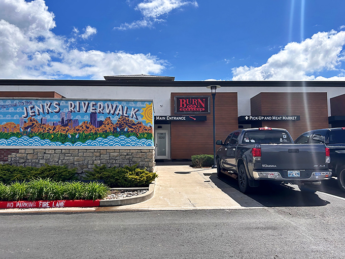 The unassuming entrance to BBQ paradise. Burn Co's modest exterior at Jenks Riverwalk belies the smoky magic happening inside.