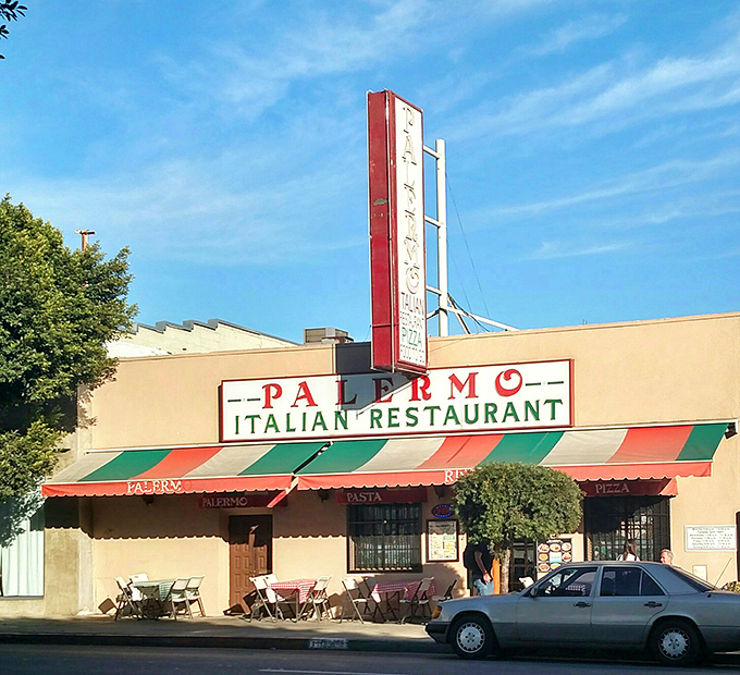 The iconic red and green striped awning of Palermo stands as a time capsule on Los Feliz Boulevard, promising Italian comfort without the Hollywood fanfare.