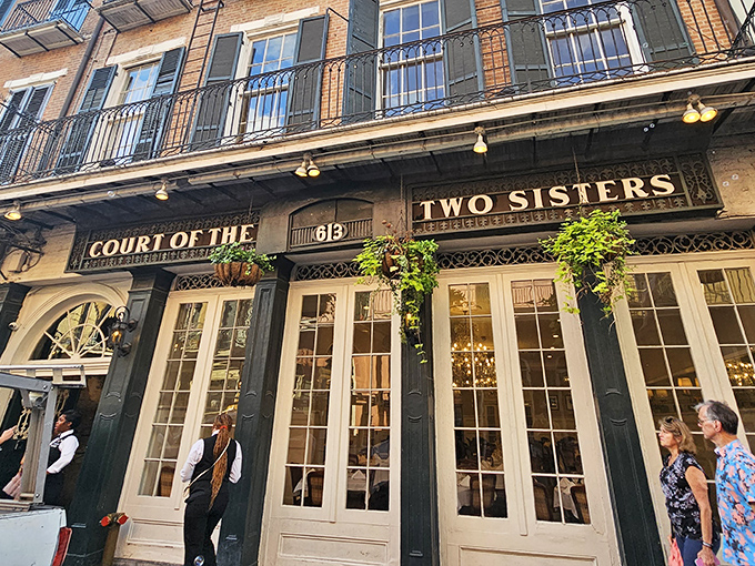 On Royal Street, the Court of Two Sisters welcomes you with its green fa&ccedil;ade and the irresistible promise of true New Orleans flavor.
