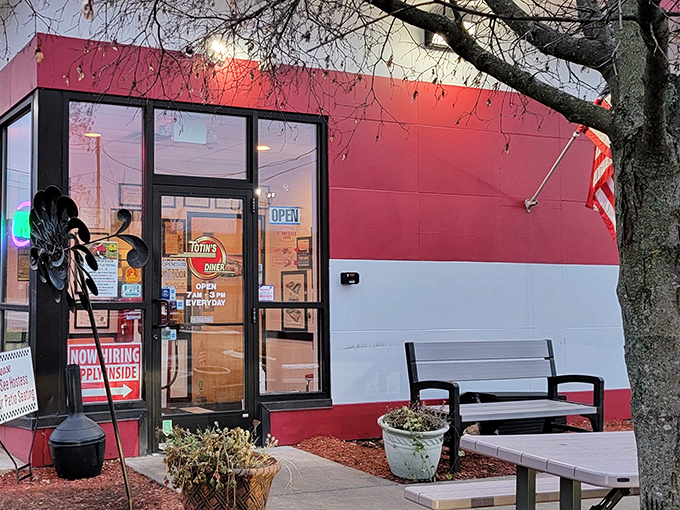 The bright red-and-white exterior of Totin's Diner stands out like a beacon for breakfast lovers. Simple, unassuming, and promising delicious things inside.