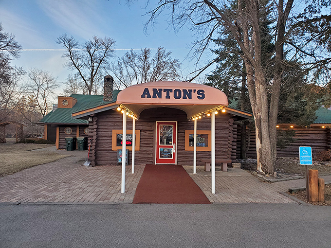 Anton's rustic log cabin exterior isn't trying to be Instagram-worthy—it just naturally is. Minnesota supper club perfection awaits beyond that welcoming red door.