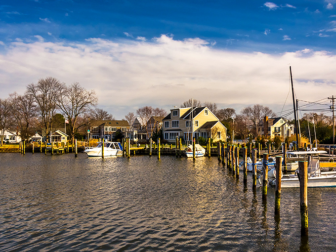 Oxford's waterfront homes stand like sentinels watching over their boat companions, a scene so perfectly Maryland it should be on license plates.