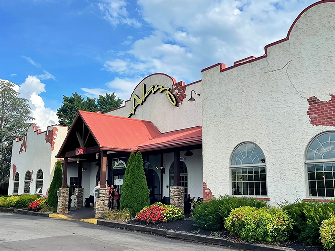 The distinctive mission-style exterior of Alamo Steakhouse welcomes carnivores with Southwestern charm and the promise of Tennessee's legendary ribeye.