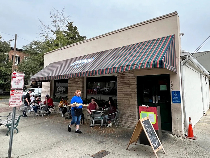 The striped awning of Clary&rsquo;s Cafe shines like a breakfast beacon, guiding hungry souls through Savannah&rsquo;s historic streets.