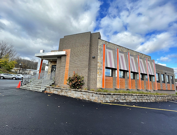 The brick and orange-accented exterior of Hibernia Diner stands ready to welcome hungry travelers like a culinary lighthouse in Rockaway's sea of suburban sprawl.