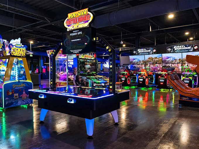 Battle Royale arcade games illuminate the space like a neon dreamscape, where friendly competition and flashing lights create the perfect storm of nostalgic gaming bliss.