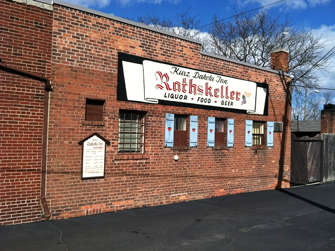 The unassuming brick exterior of Dakota Inn Rathskeller stands like a secret portal to Bavaria, complete with charming blue shutters and a promise of German delights within.