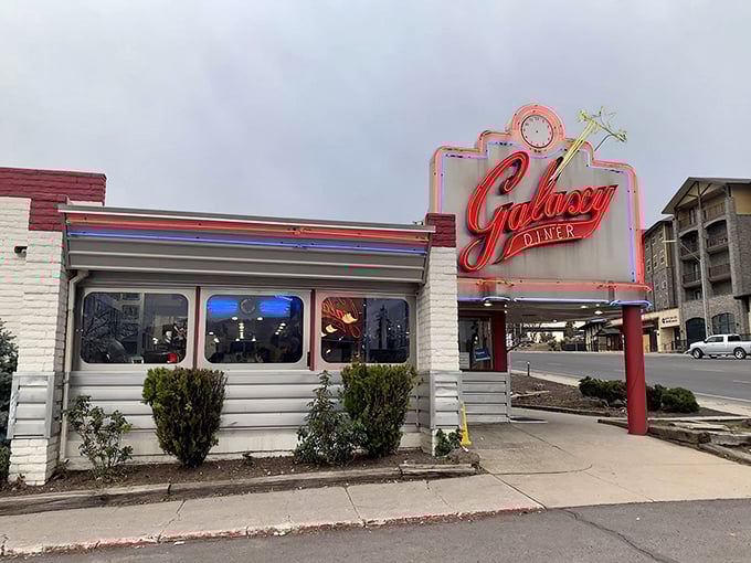 That iconic neon sign beckons like a beacon of hope for hungry travelers on Route 66. Galaxy Diner's retro exterior promises a journey back in time.