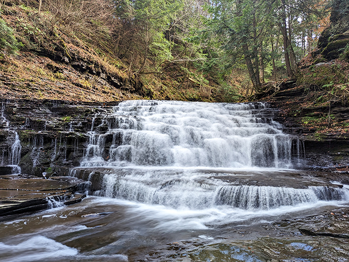 Water dances across layered stone in a hypnotic display that would make even the most dedicated Netflix binger put down the remote.
