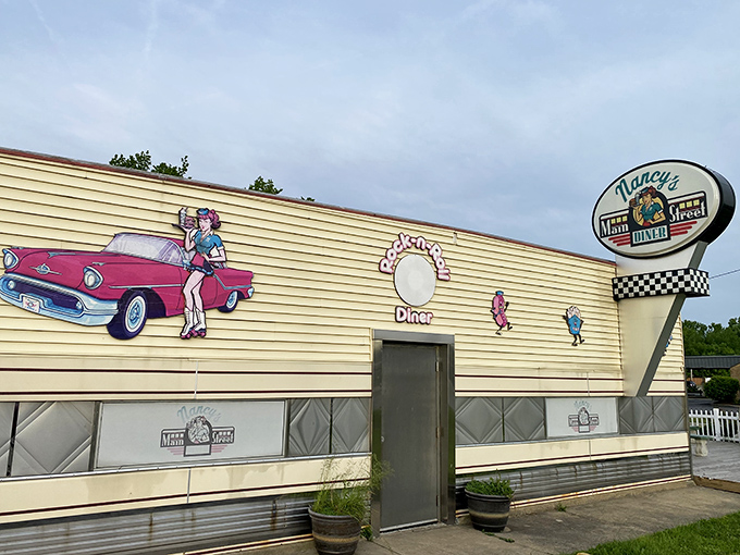 That iconic 50's mural with the vintage car and roller-skating waitress promises more than decoration&mdash;it's a preview of the authentic experience waiting inside.