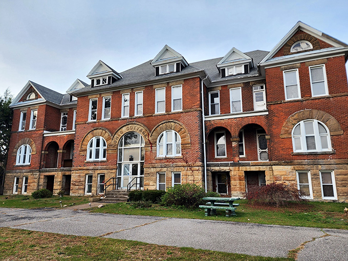 The imposing facade of Madison Seminary stands as a brick-and-mortar time capsule, its windows seemingly watching your every move as you approach.