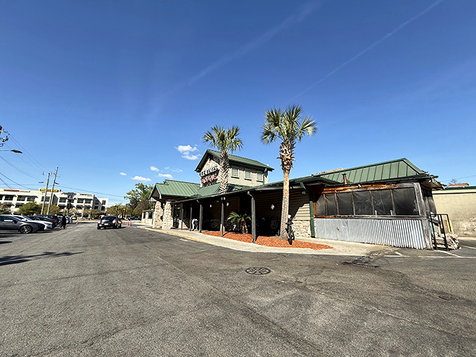 The modest exterior with its green roof and palm trees stands like a Southern sentinel guarding culinary treasures within. No fancy frills needed when the food does the talking.